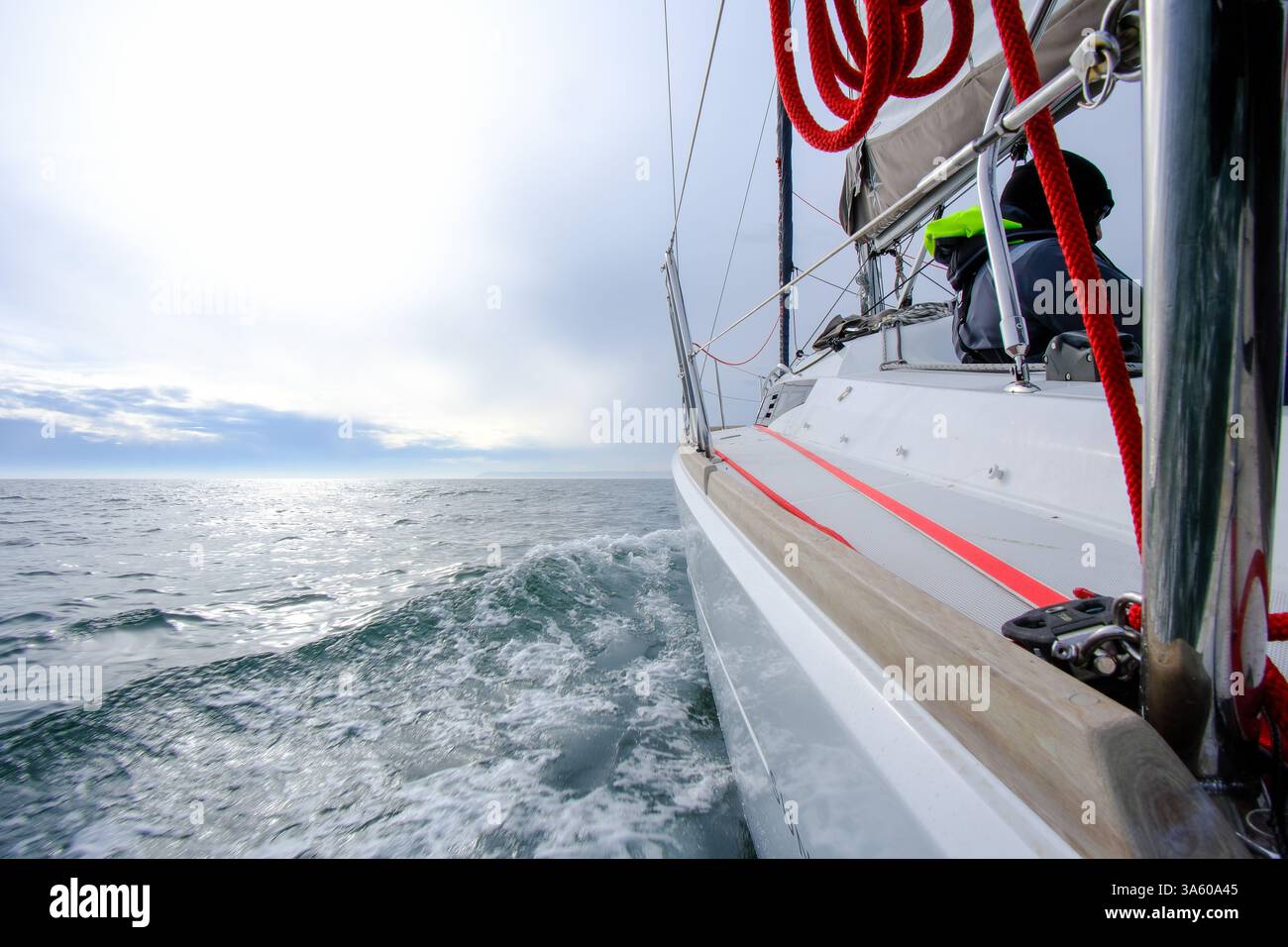 23 March 2025 - A Sailing Yacht racing and moving quickly throuhg the water, sailing in the ...