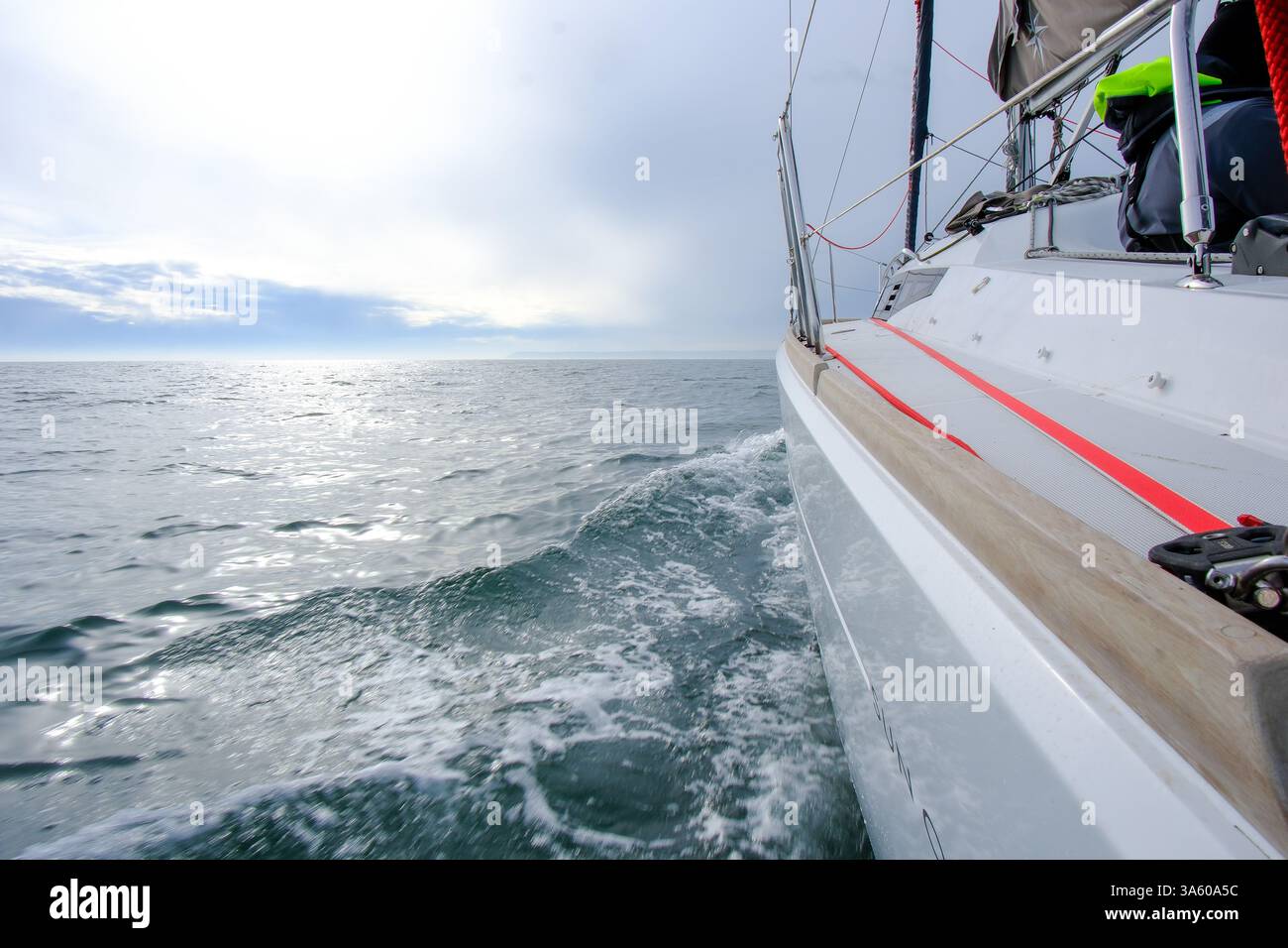 23 March 2025 - A Sailing Yacht racing and moving quickly throuhg the ...