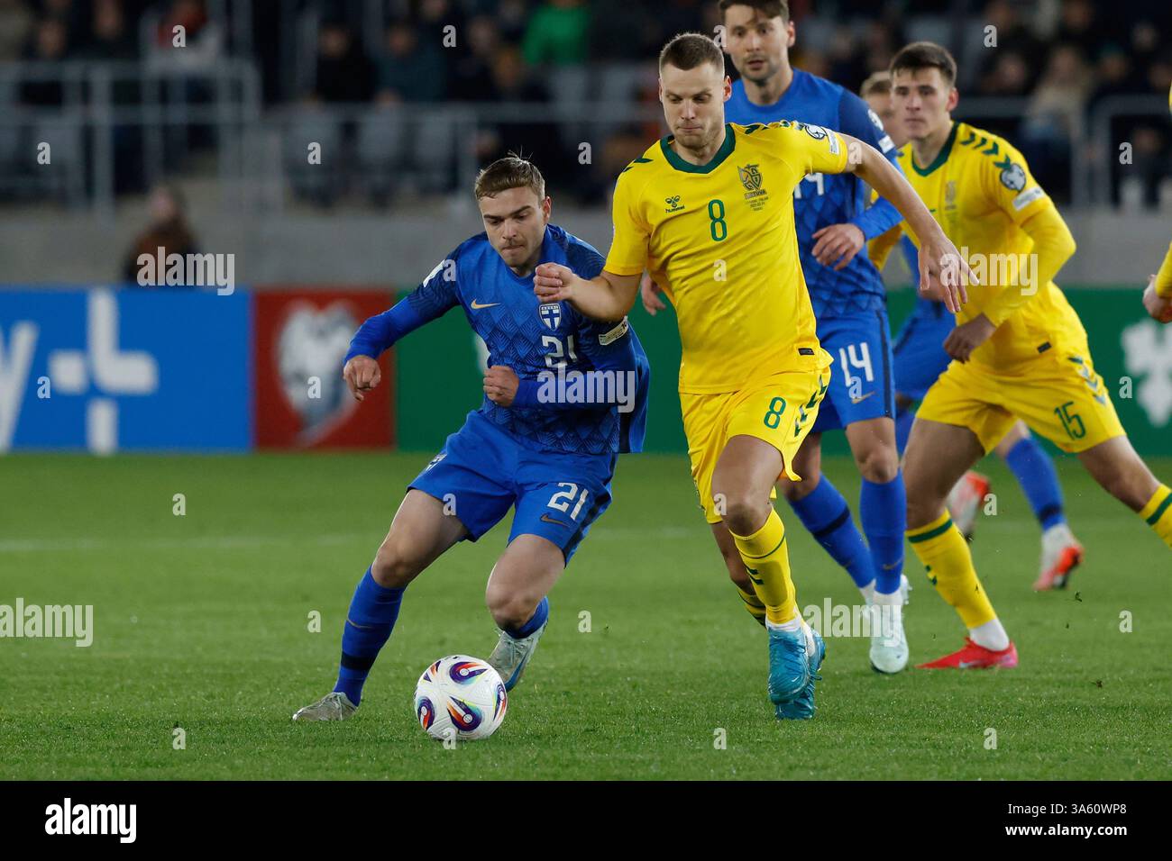 Finland's Daniel Hakans, left, fights for the ball with Lithuania's ...