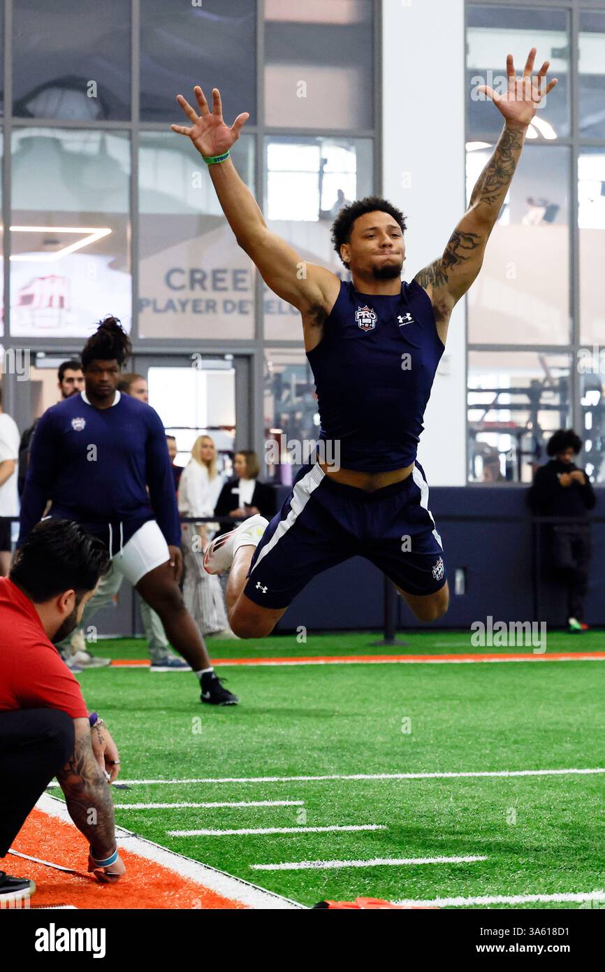 Auburn safety Jerrin Thompson performs a broad jump as he runs through ...