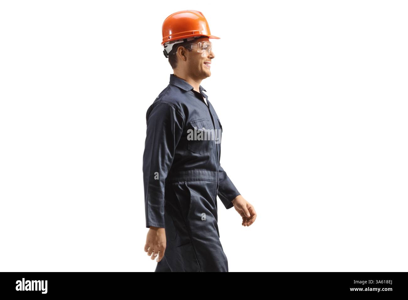Factory worker wearing a helmet and uniform and walking isolated on ...