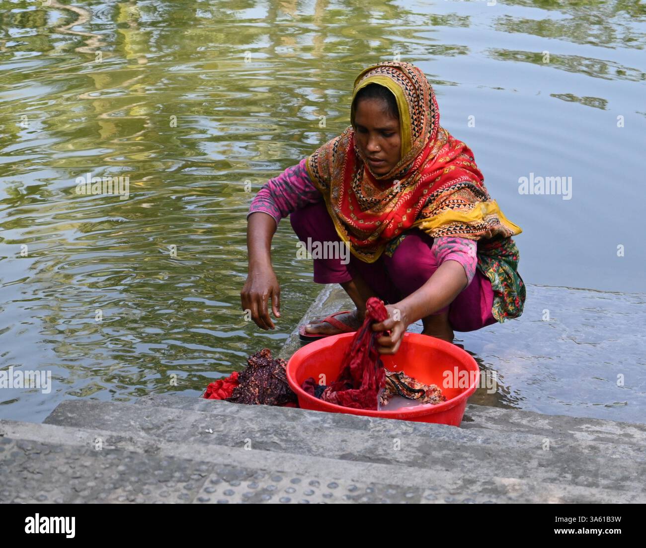 Laundry girl in Bangladshi coutryside Stock Photo - Alamy