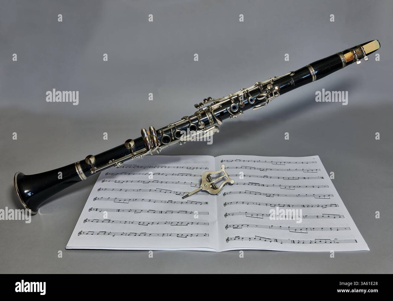 Clarinet still life on sheet music with a little music stand Stock ...