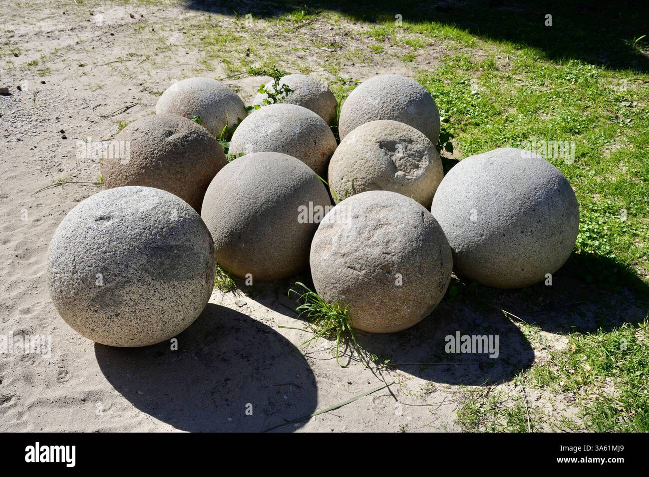 Vintage stone cannon balls in the sunshine on Rhodes, Greece Stock ...
