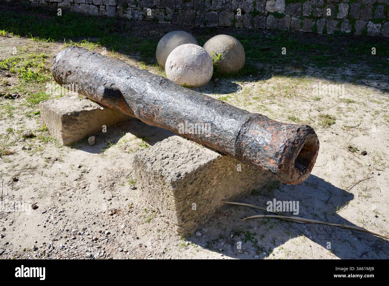 Vintage Cannon and stone cannon balls in Rhodes, Greece Stock Photo - Alamy