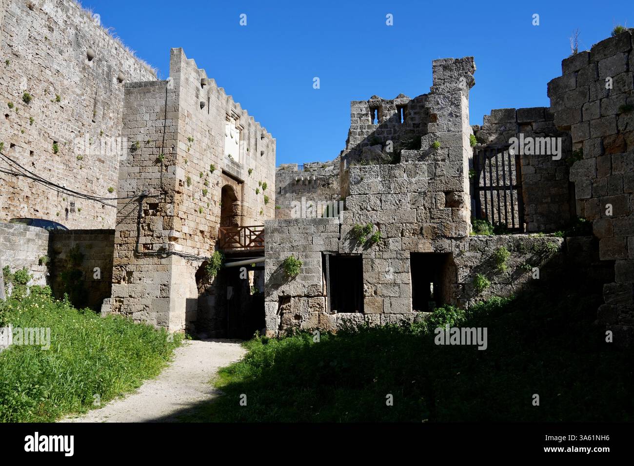 Ancient stone buildings over the Moat by the old city wall Stock Photo ...