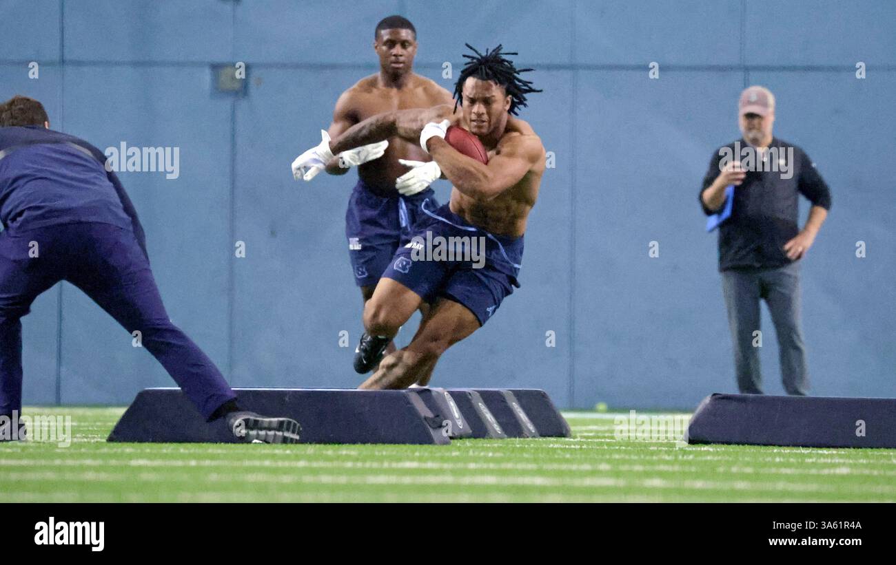 North Carolina running back Omarion Hampton, center, runs a drill at ...
