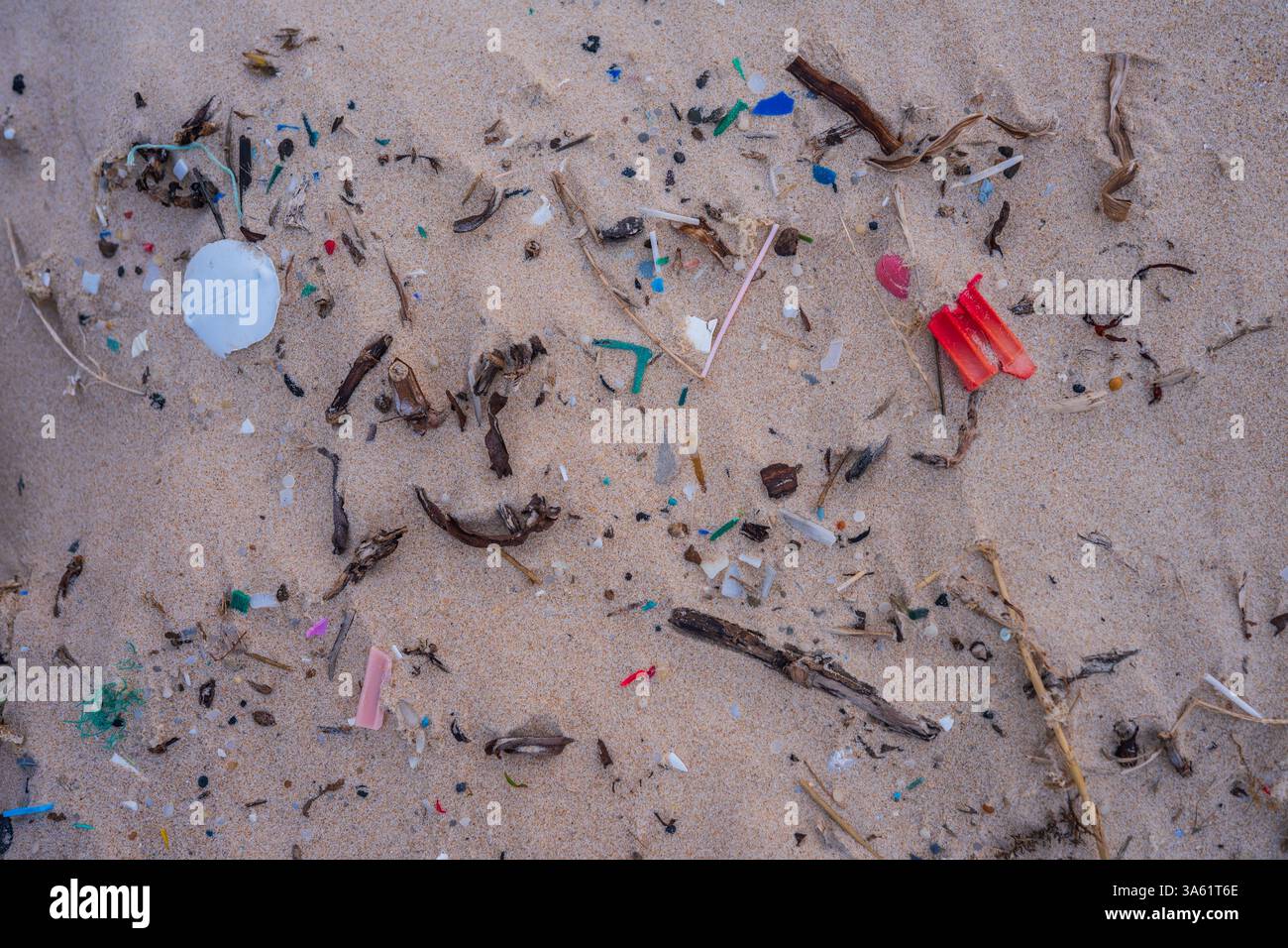 Plastics, microplastics and other debris in the beach sand Stock Photo ...