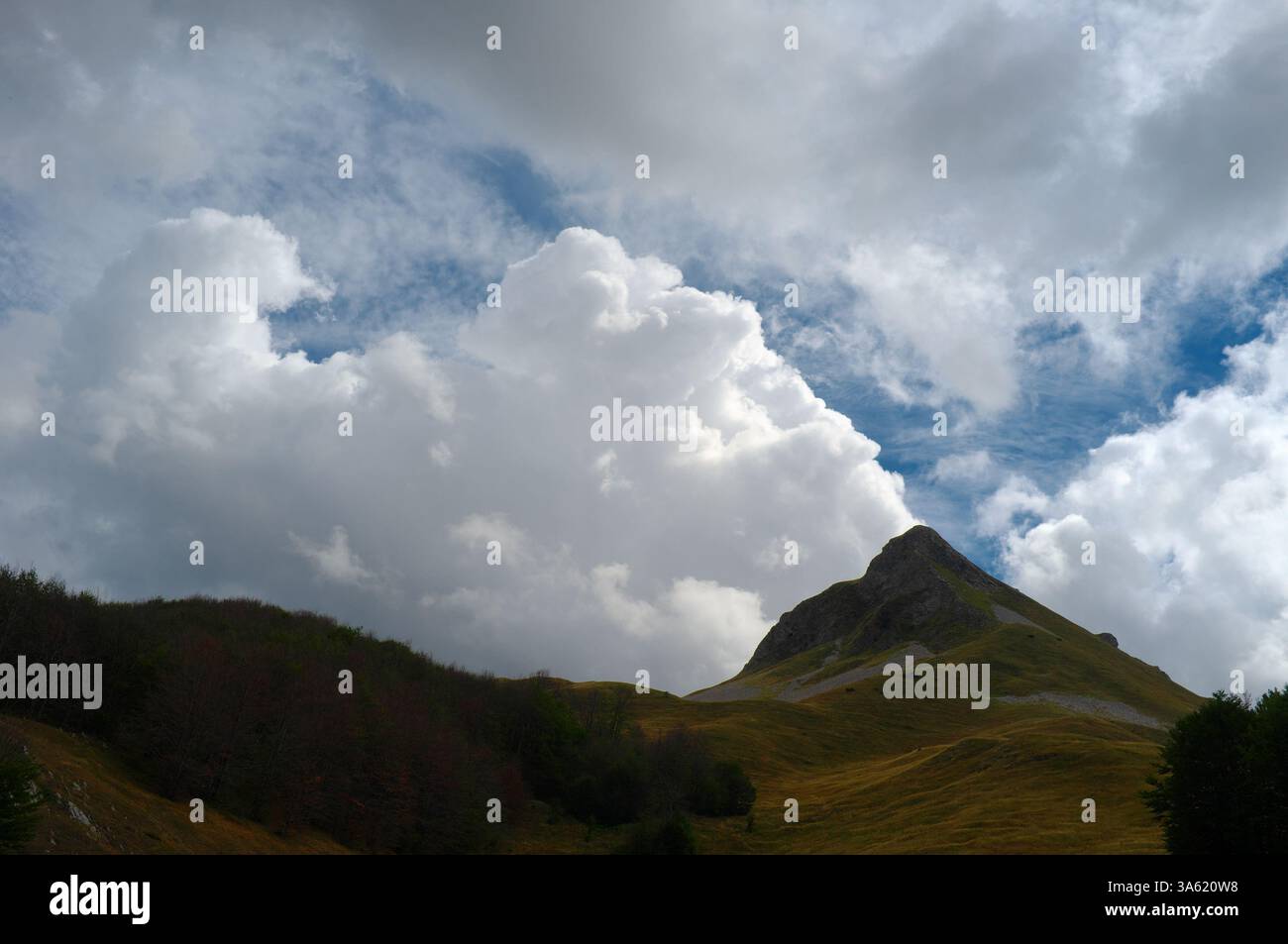blue sky with grey clouds and Stog mountain peak in Sutjeska National ...