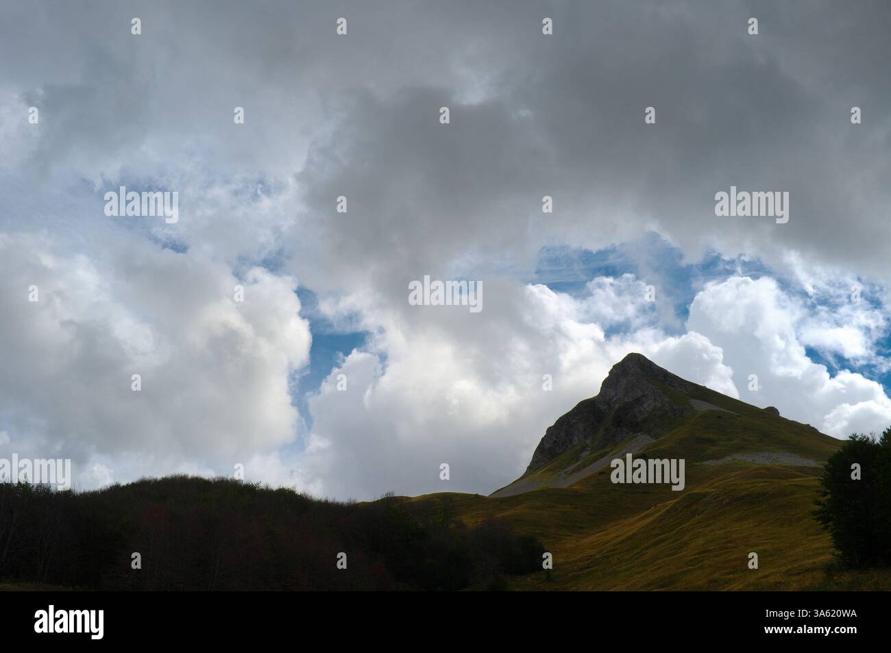 blue sky with grey clouds and Stog mountain peak in Sutjeska National ...