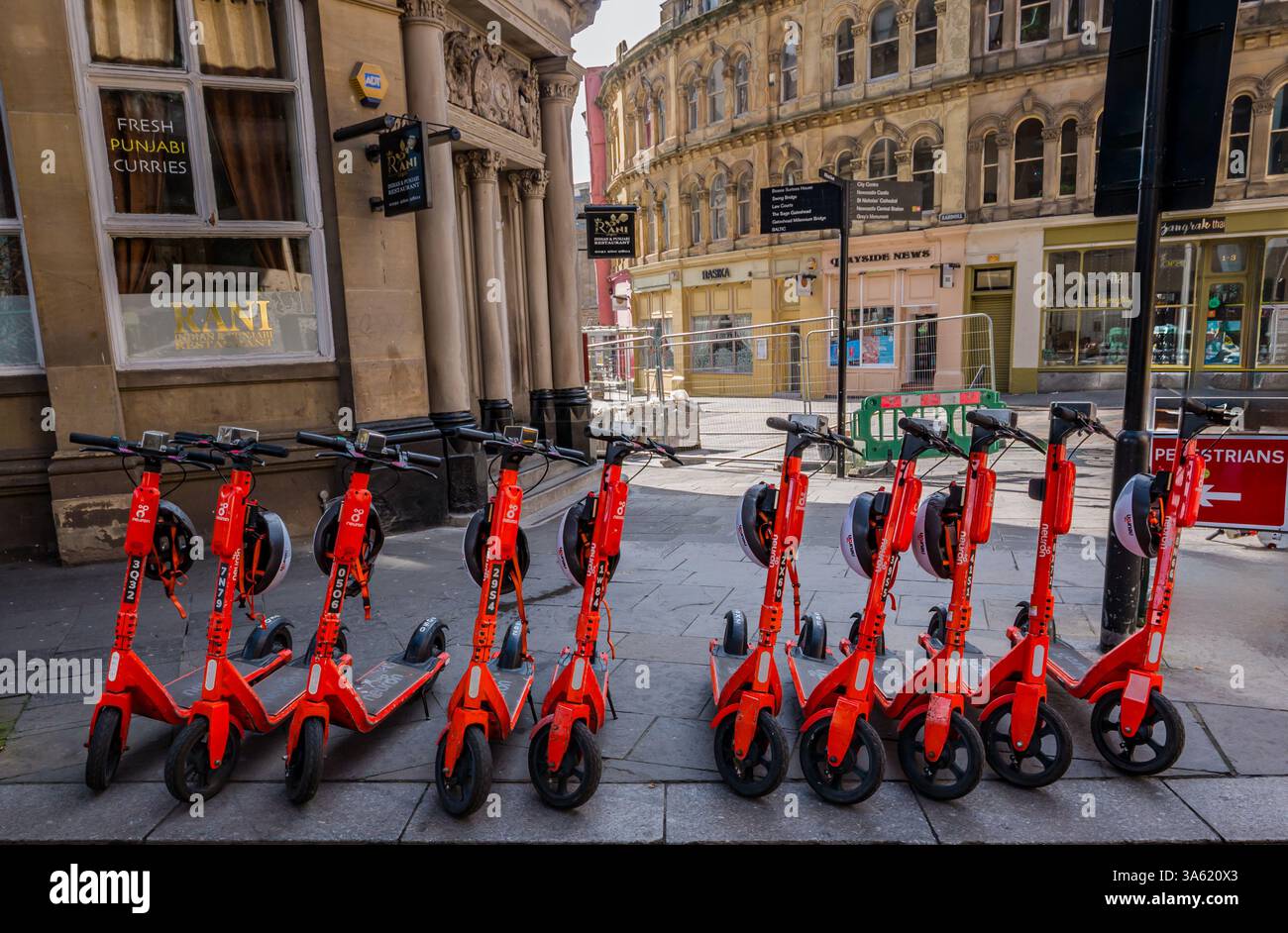 Neuron Mobility e-scooters with helmets for hire on street, Newcastle ...
