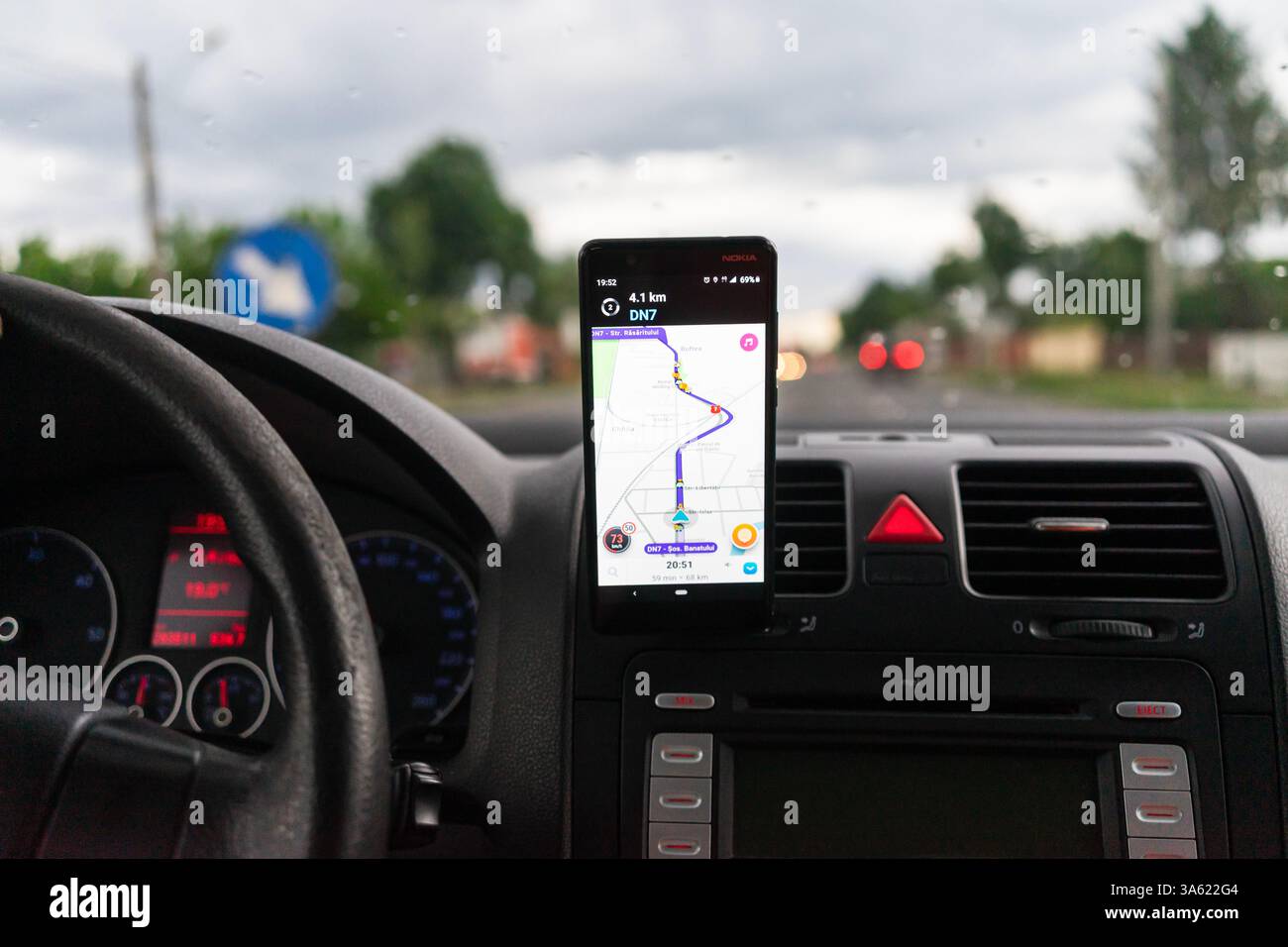 Using Waze maps application on smartphone on car dashboard Stock Photo ...