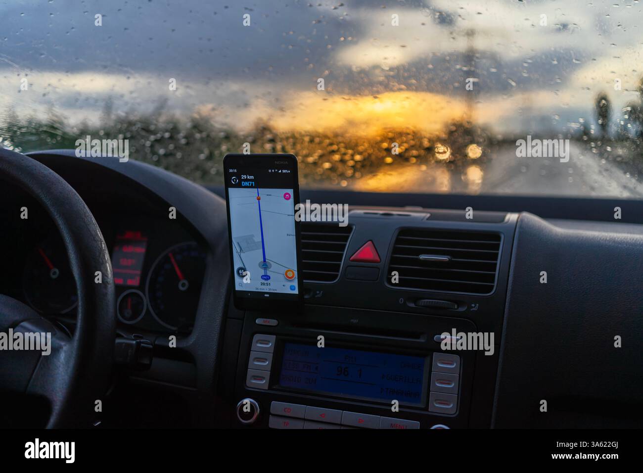 Using Waze maps application on smartphone on car dashboard Stock Photo ...