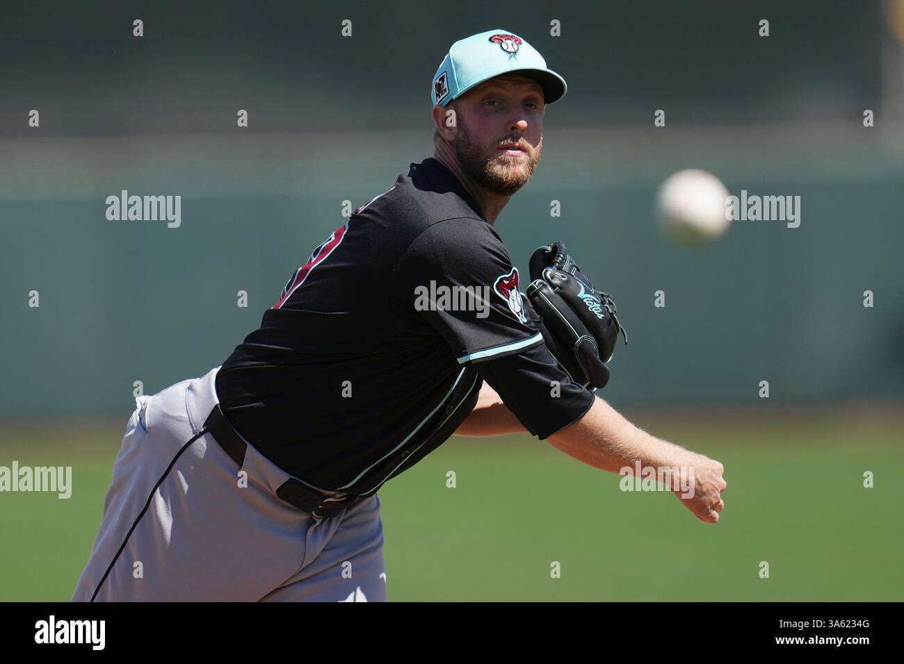 Arizona Diamondbacks pitcher Merrill Kelly warms up during the first ...