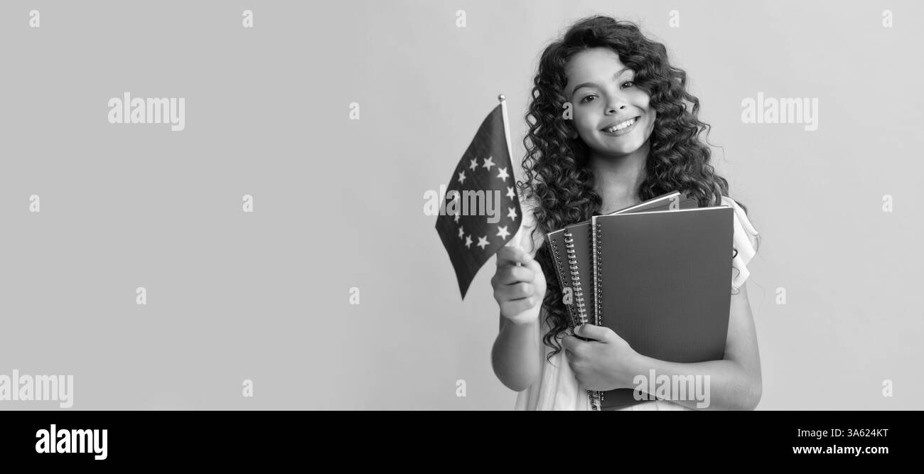 happy teen girl study with school workbooks hold european union flag ...