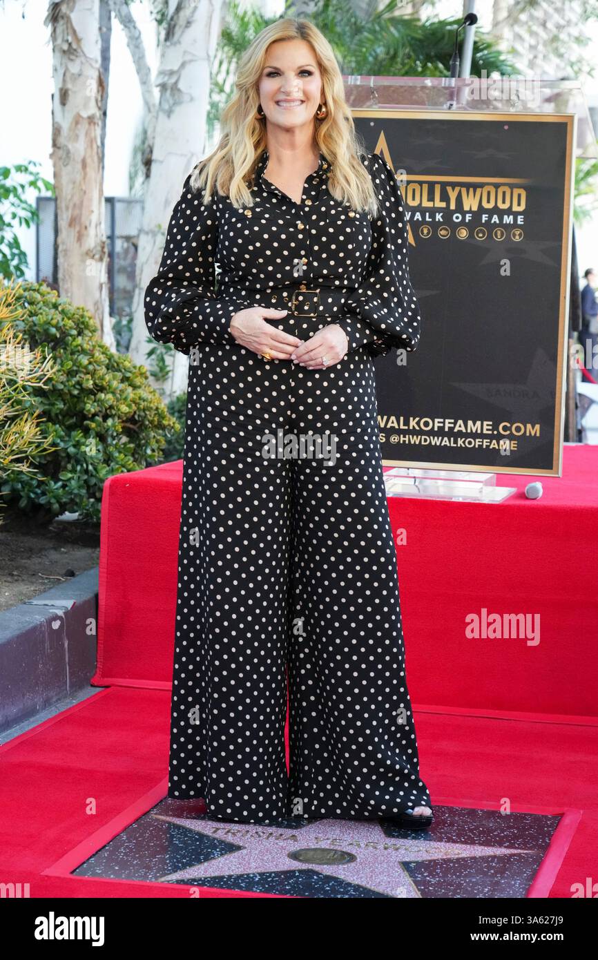 Trisha Yearwood poses with her new star at a ceremony on the Hollywood ...