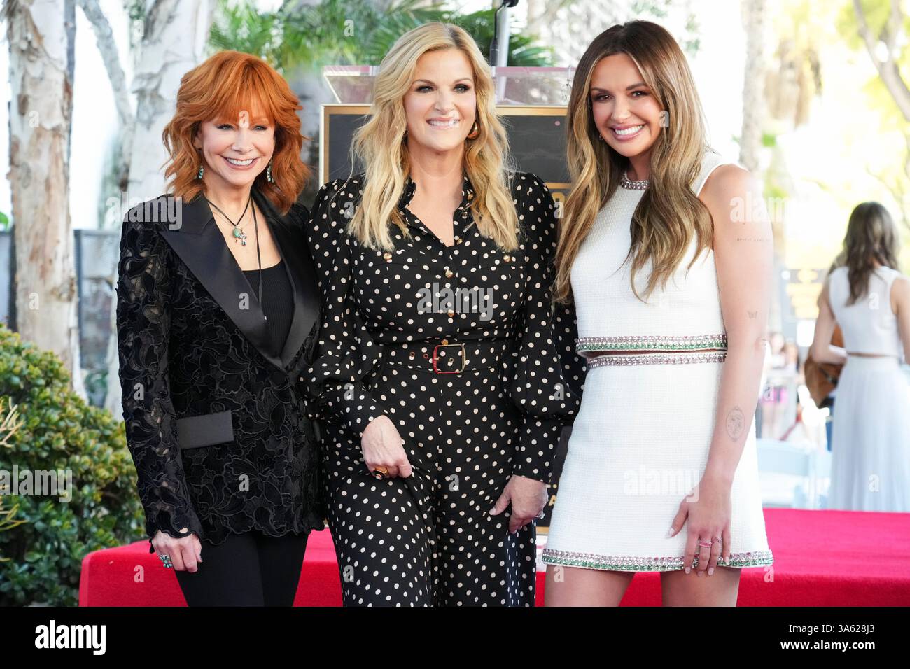 Reba McEntire, from left, Trisha Yearwood, and Carly Pearce pose with ...