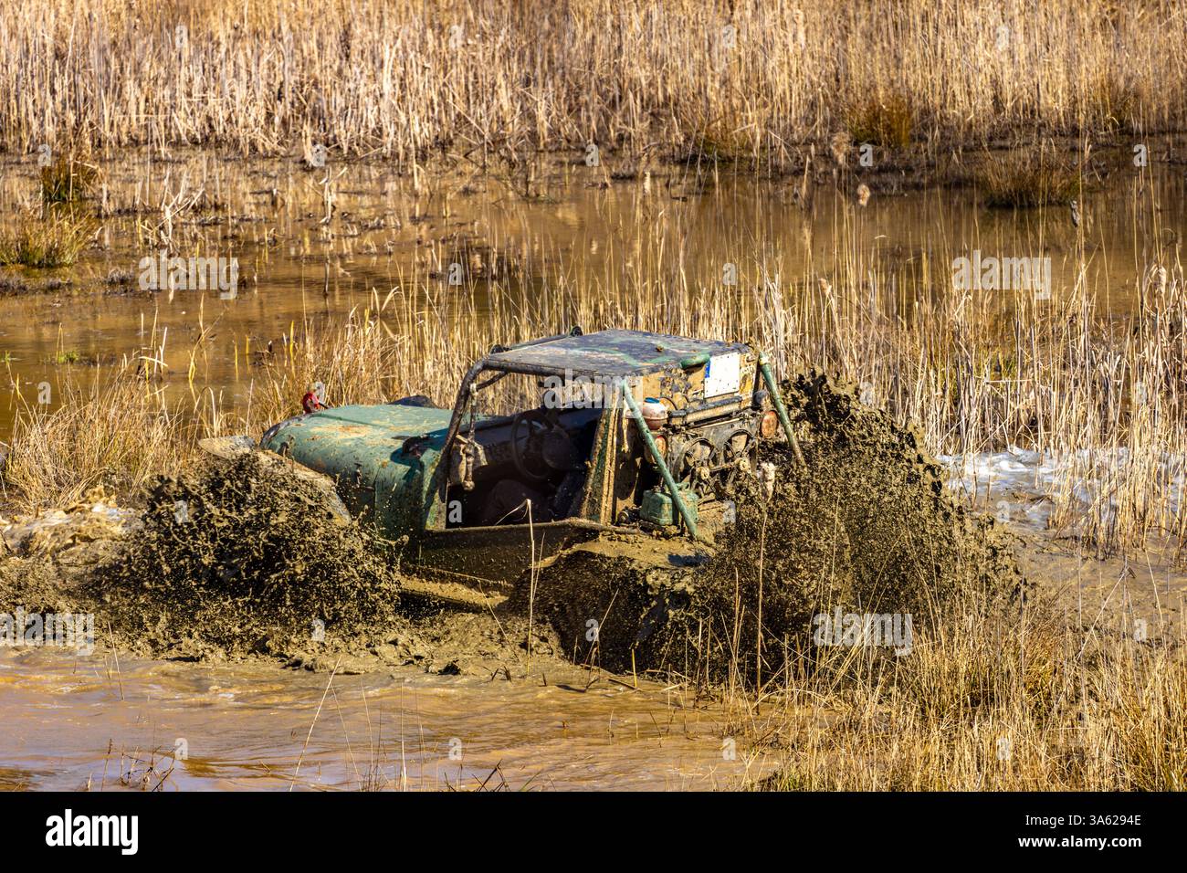 Attempt to drive over a large obstacle with water hi-res stock ...
