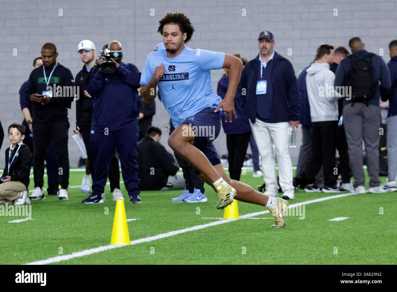 North Carolina tight end Bryson Nesbit runs a drill at the school's NFL ...