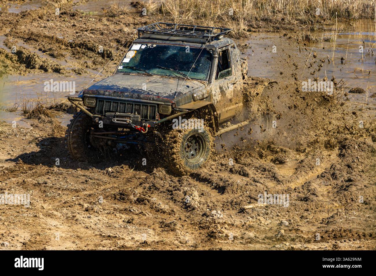 Attempt to drive over a large obstacle with water hi-res stock ...