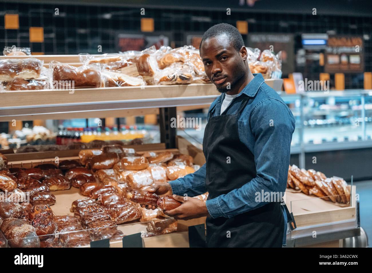 Man standing near shelves goods hi-res stock photography and images - Alamy