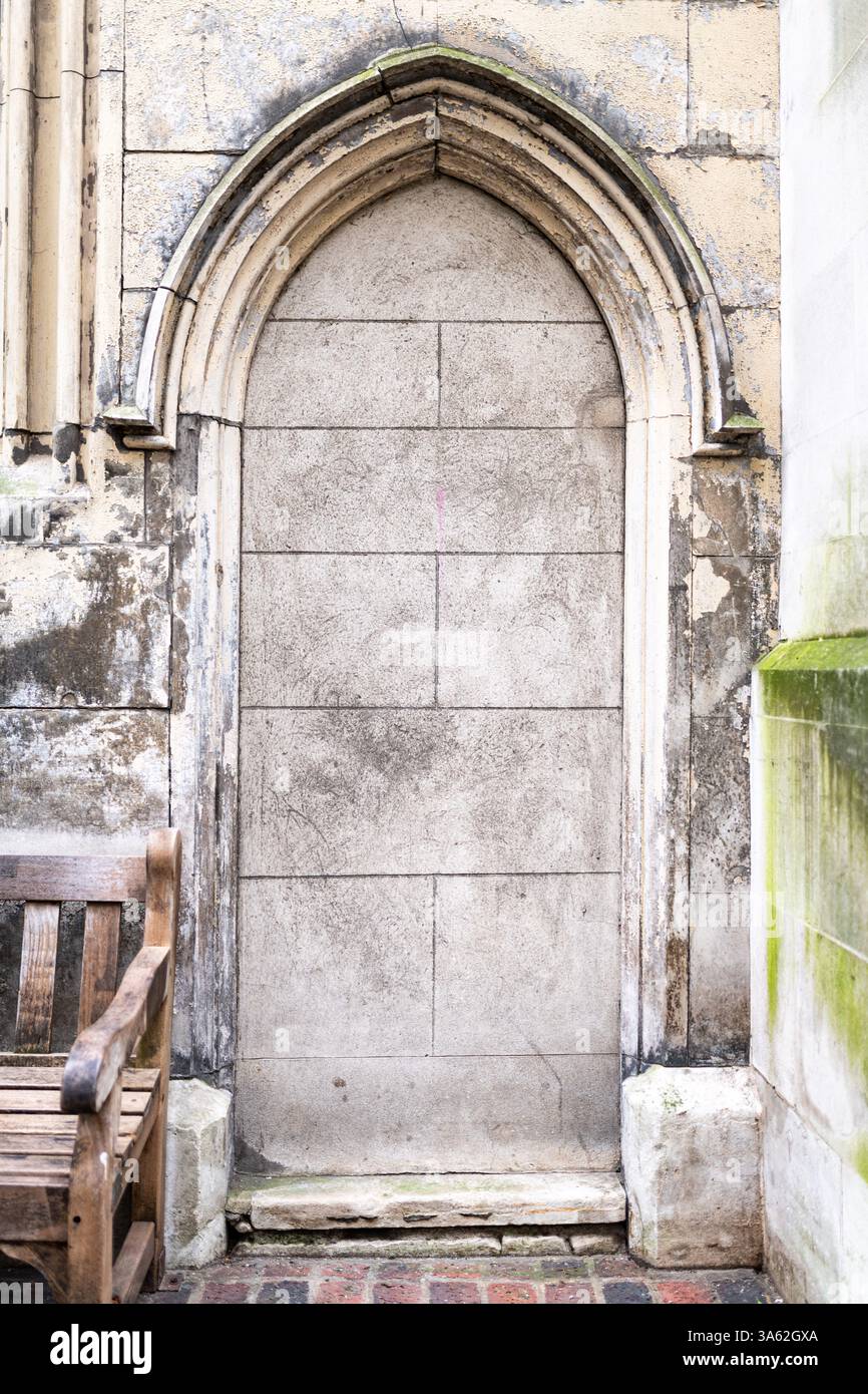An old arch doorway filled with stone at St Dunstan in the East Church ...