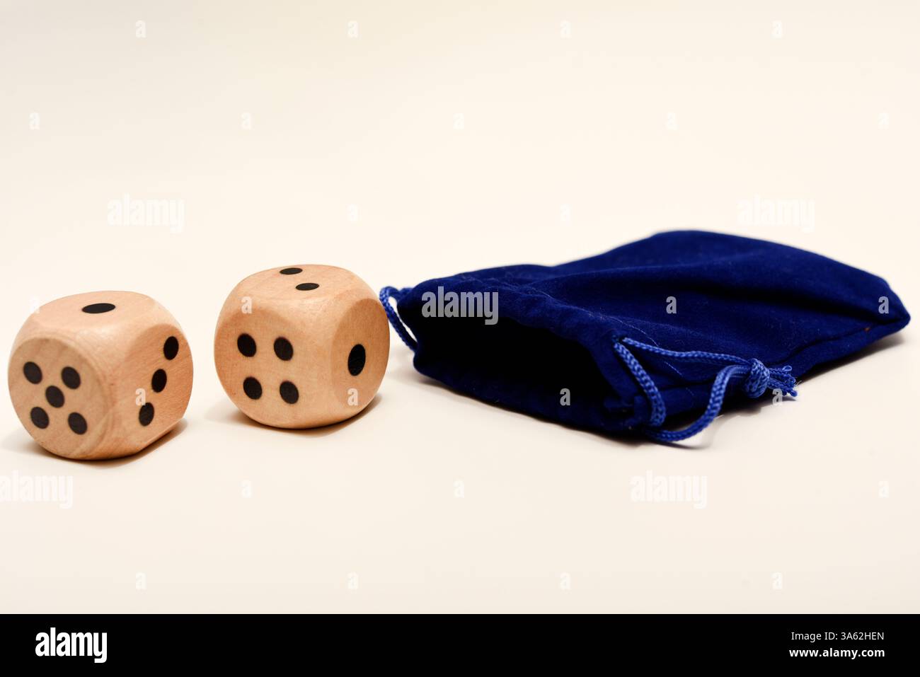 Dice on a white background. Large and small dice Stock Photo - Alamy