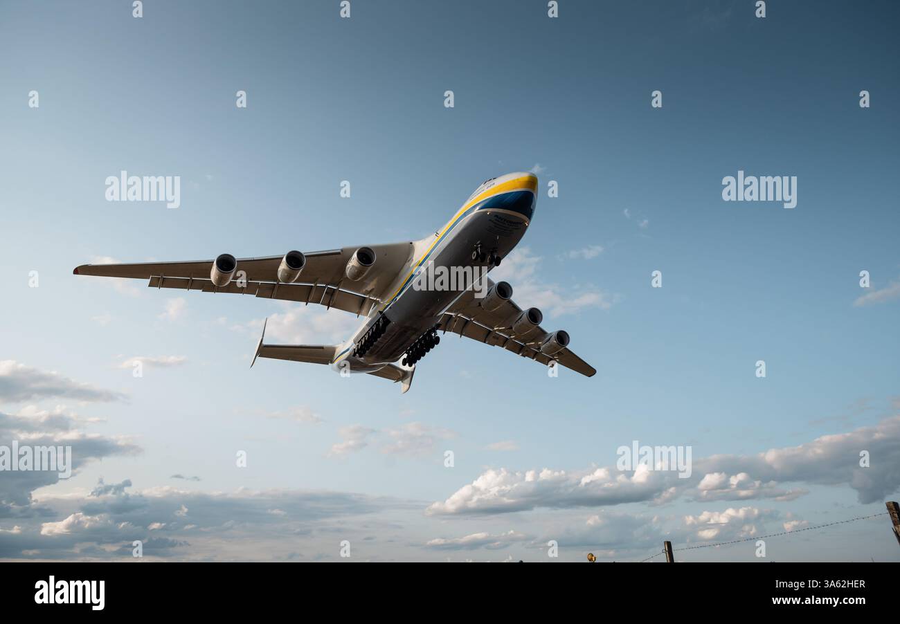An-225 cargo plane on final approach to airport runway. Looking up at ...