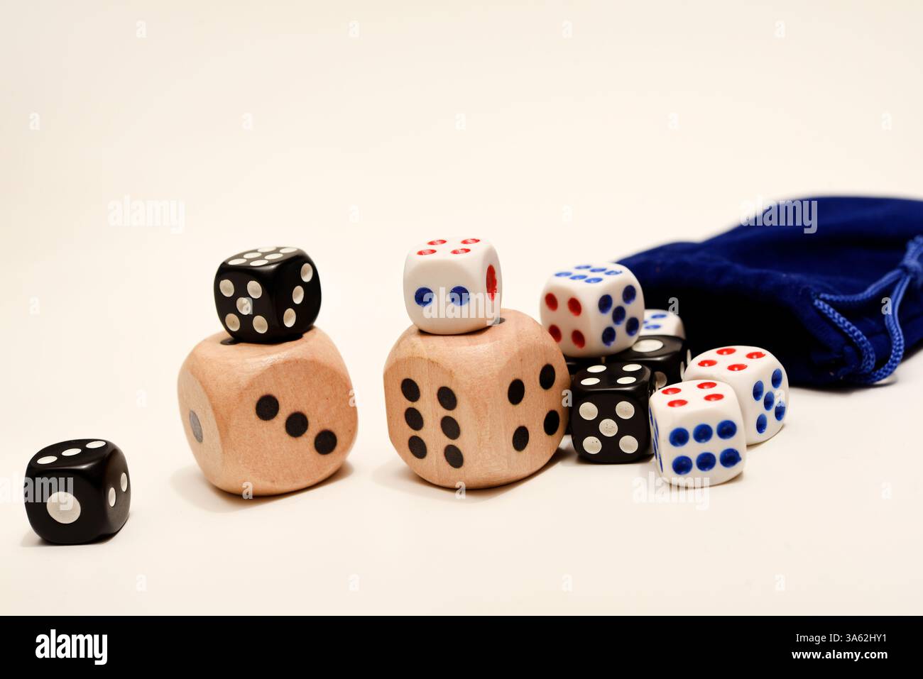 Dice on a white background. Large and small dice Stock Photo - Alamy