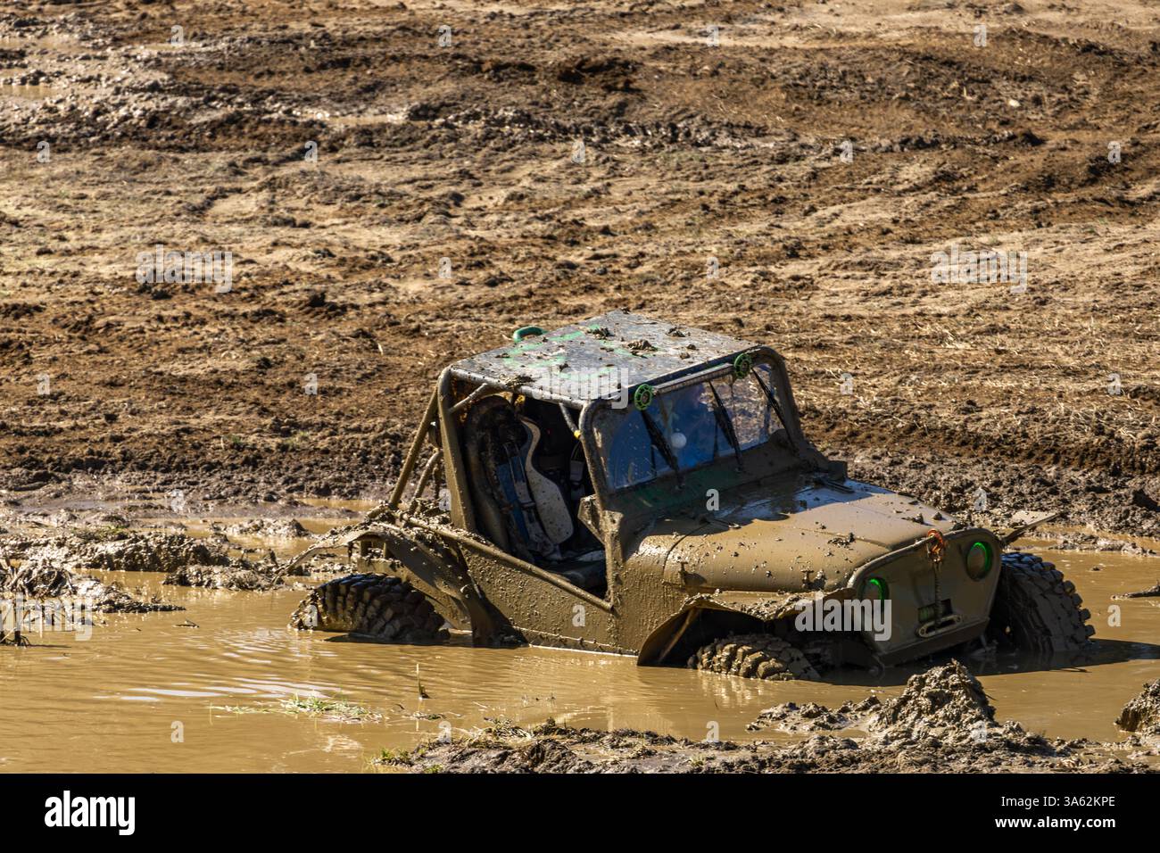 Damaged off-road vehicle, flooded engine, vehicle stuck in a ditch with ...