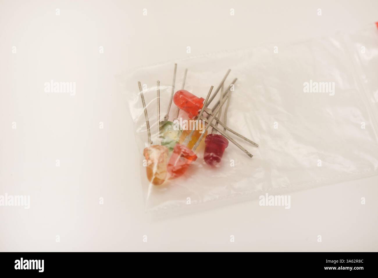 Multi-colored LEDs. Old LEDs on a white background Stock Photo - Alamy