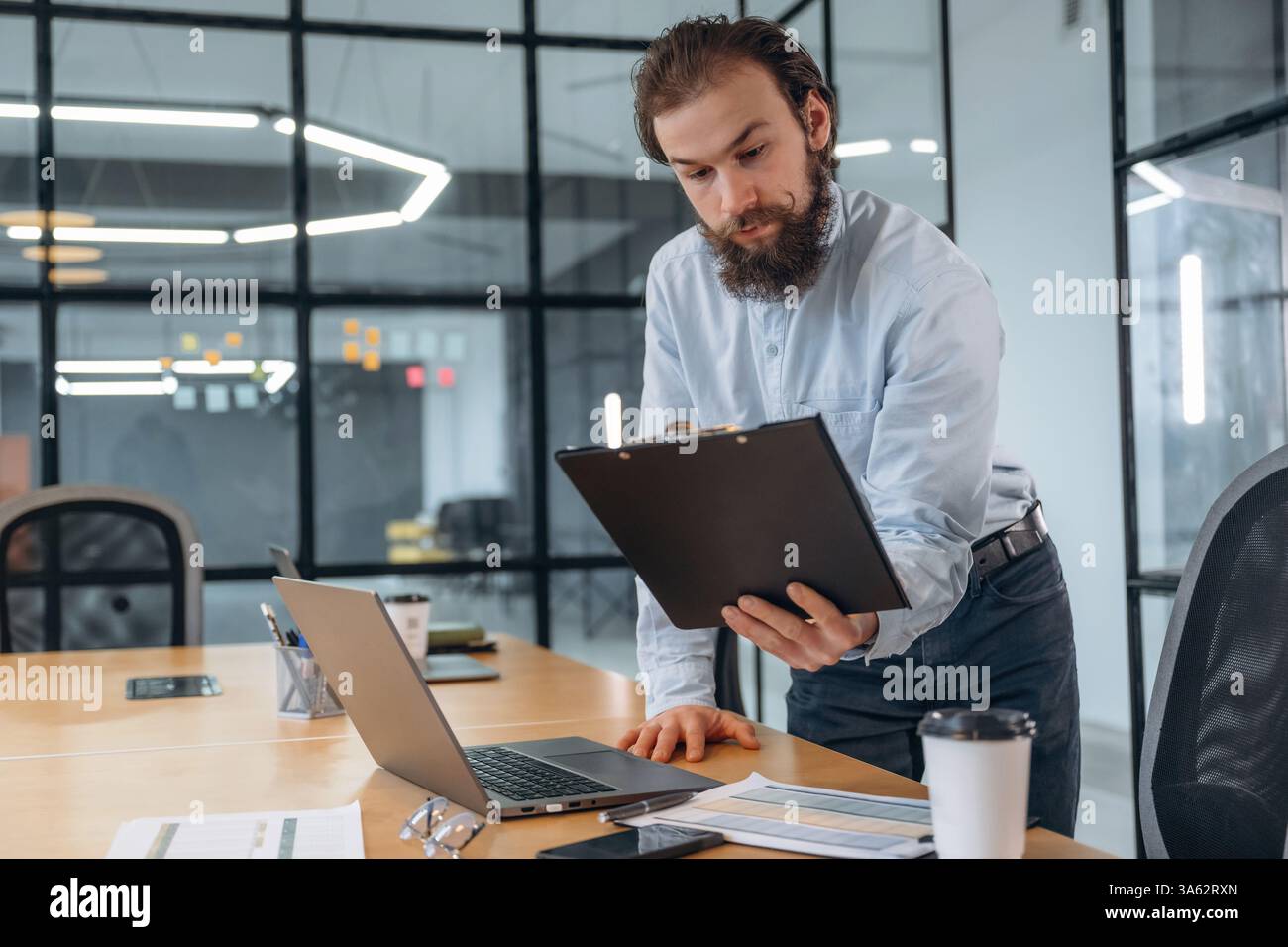 Busy holding laptop notepad hi-res stock photography and images - Alamy