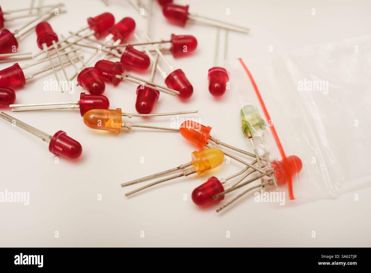 Multi-colored LEDs. Old LEDs on a white background Stock Photo - Alamy