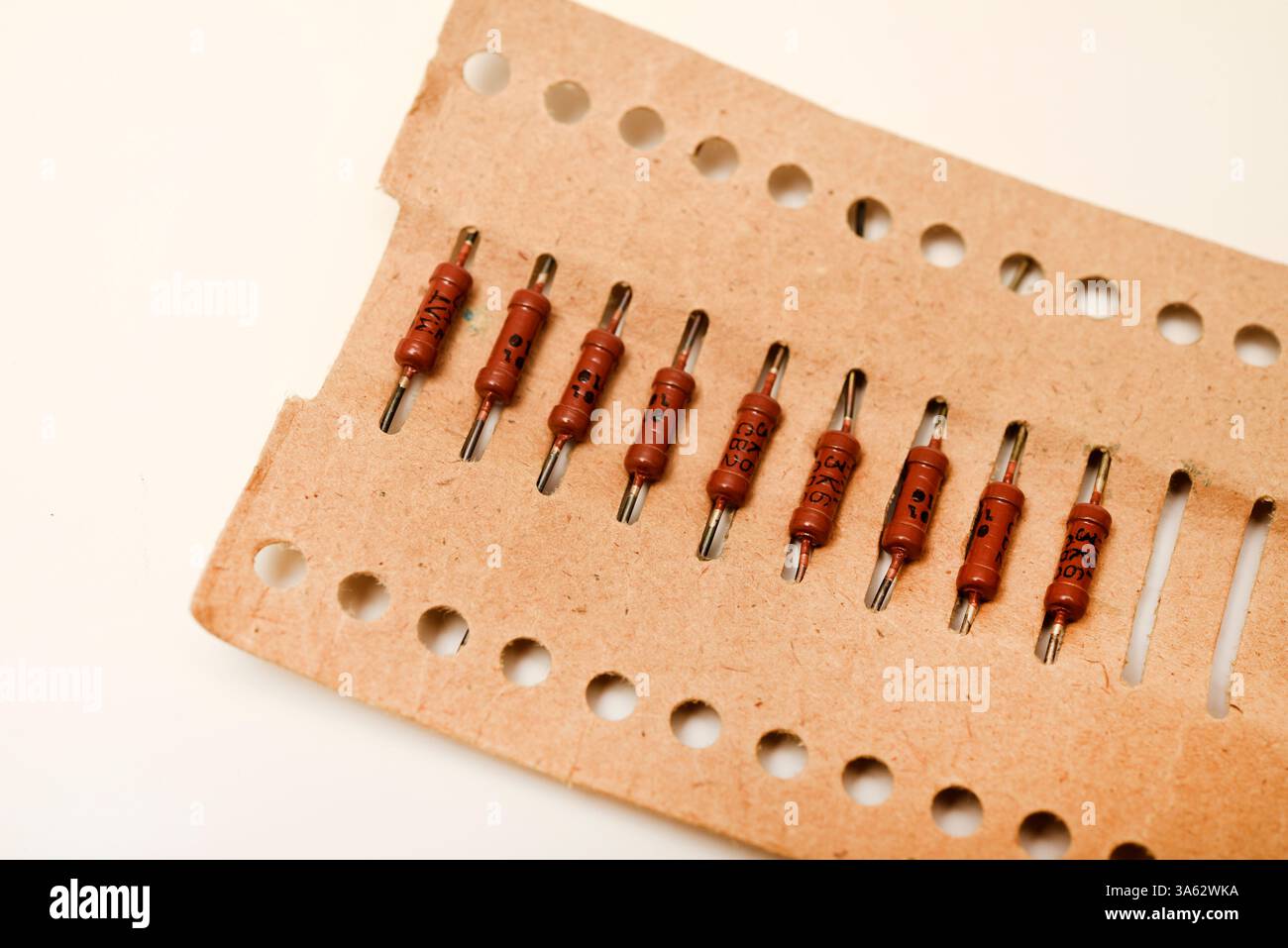 Brown resistor in a paper package. The electronic component Stock Photo ...