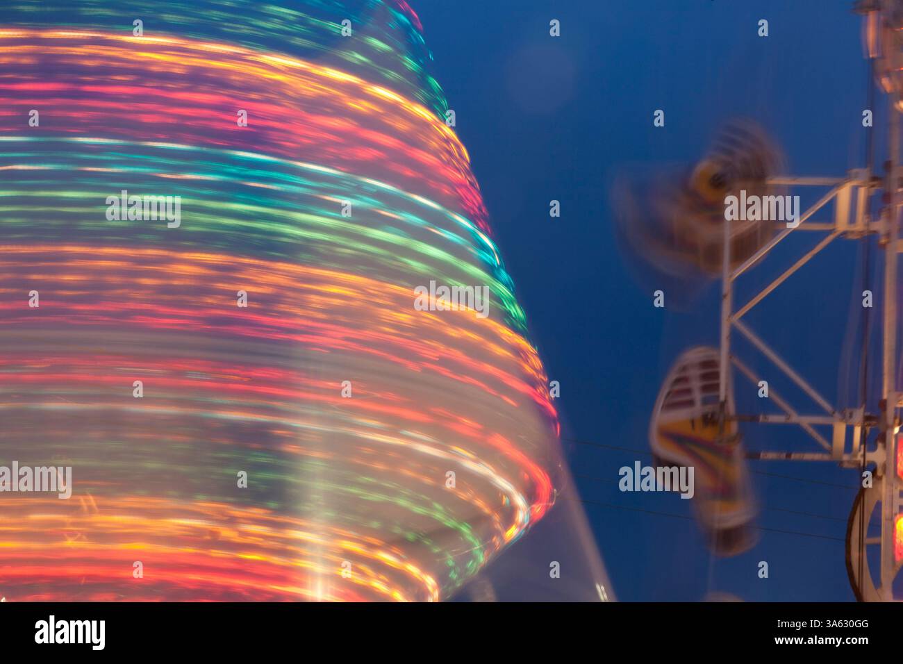 Funfair fairground ride sunset hi-res stock photography and images - Alamy