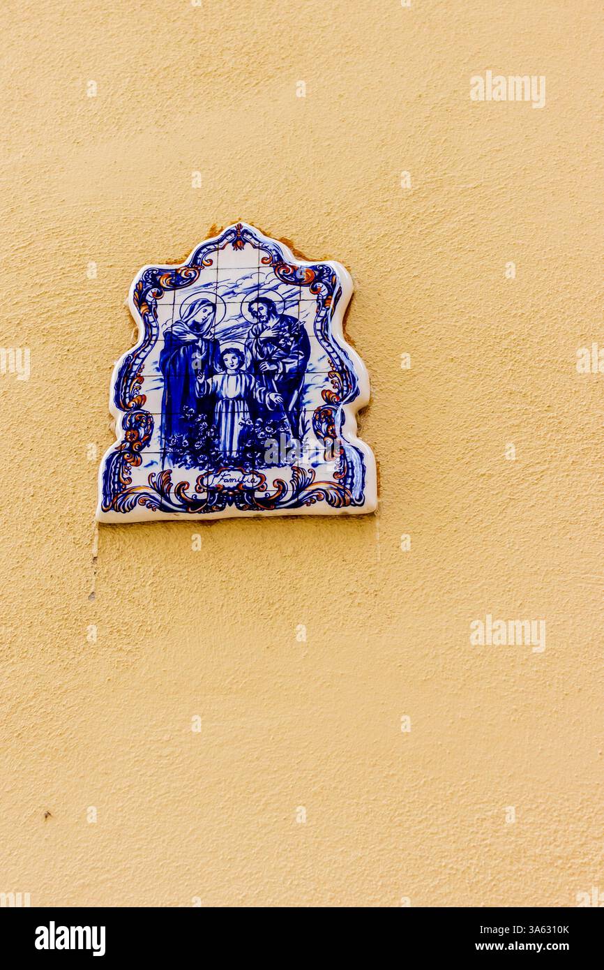 Decorative Ceramic Tile Depicting Religious Figures on a Yellow ...