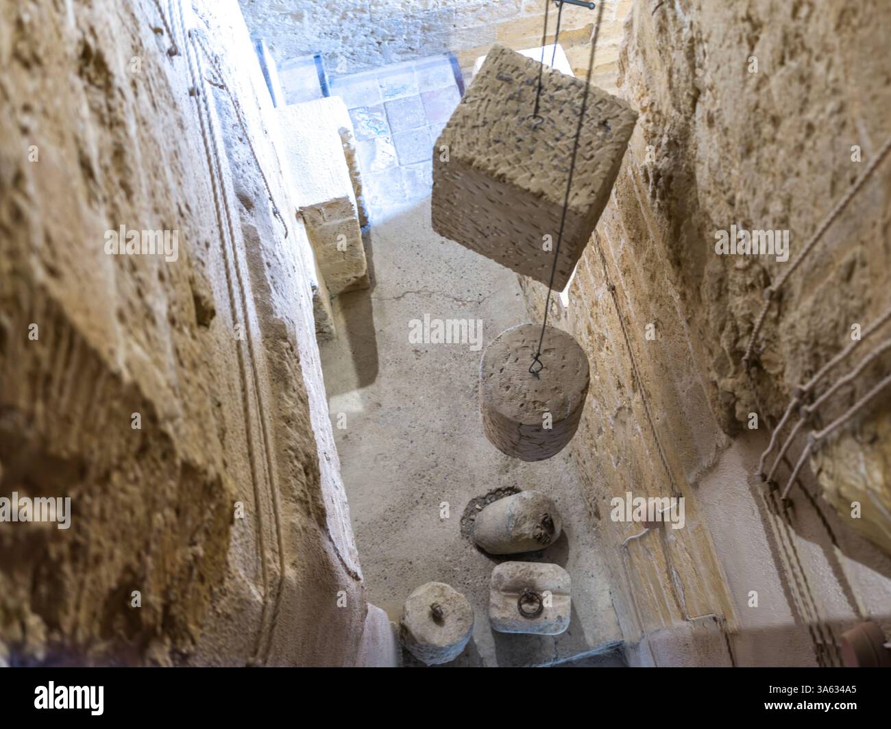 Concrete blocks suspended between walls in the hilltop city of ...