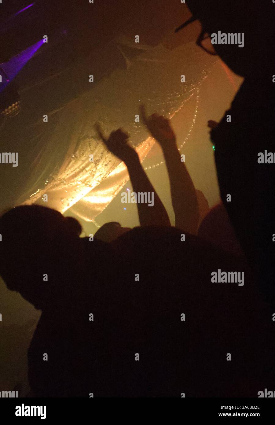 Manchester, England UK 22nd March 2025 Ravers dancing in a night club ...