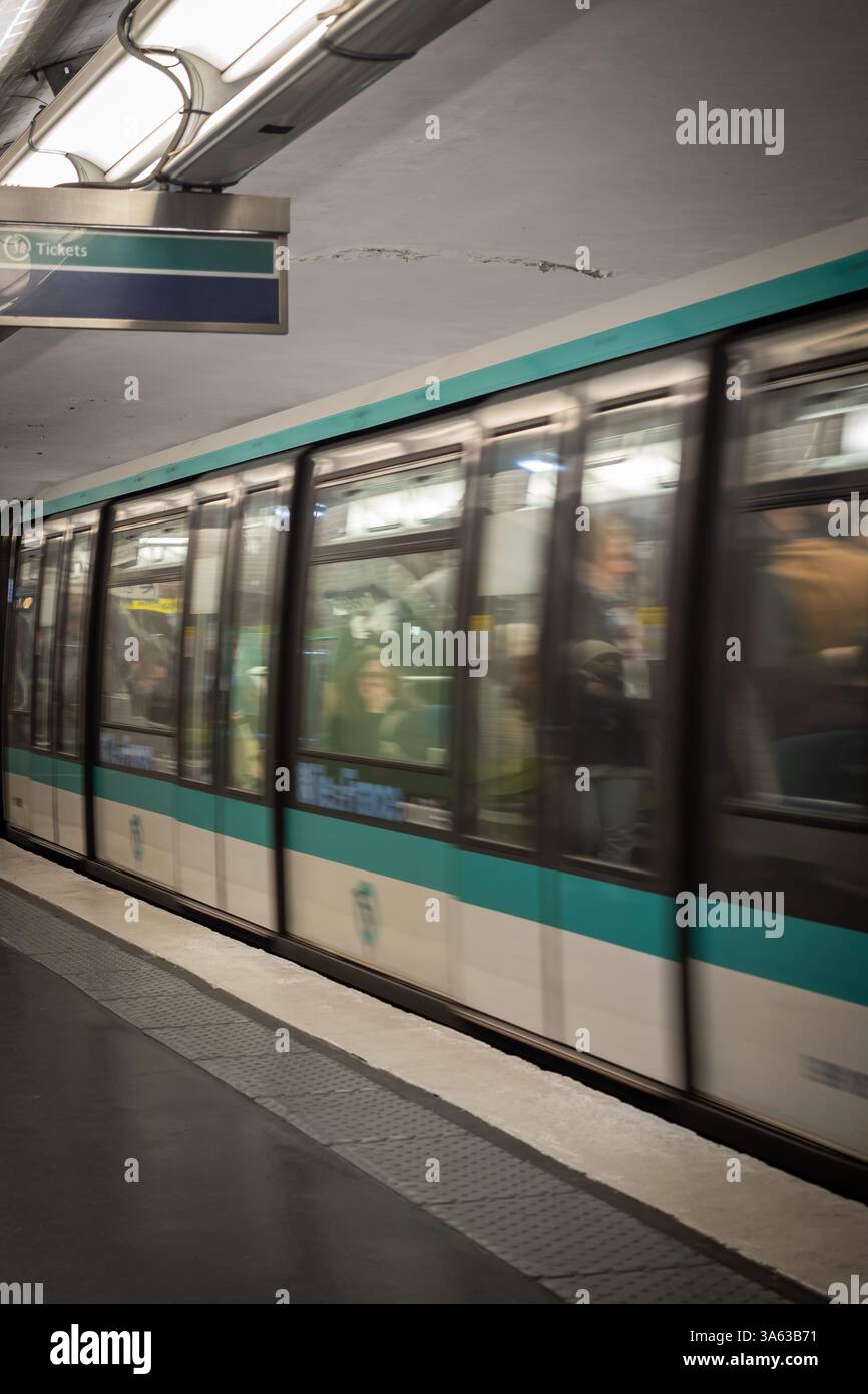 Paris Metro at the platform leaving a station in Paris - France Stock ...