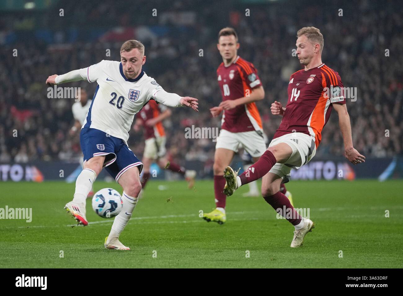 England's Jarrod Bowen kicks the ball ahead of Latvia's Andrejs ...