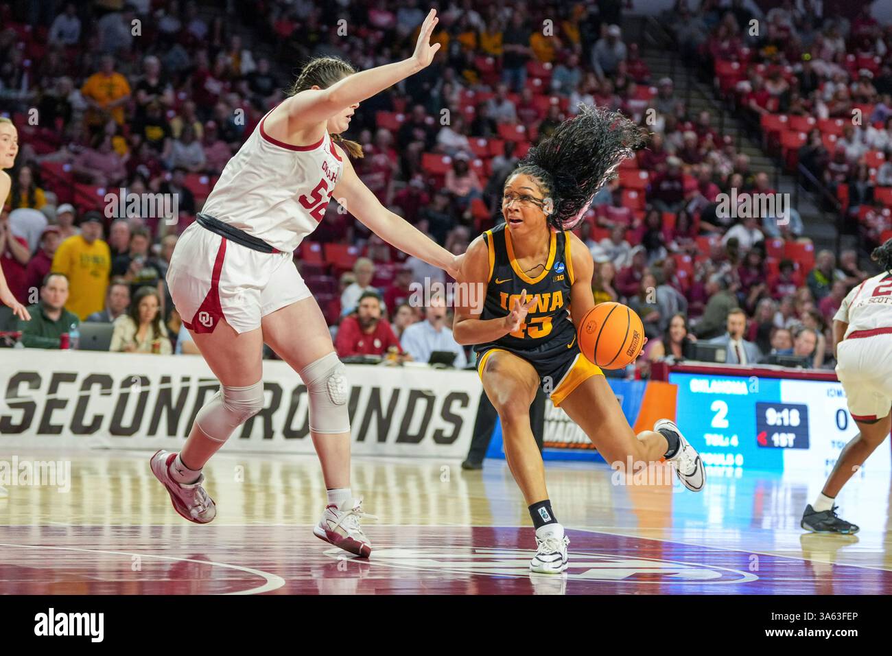 Iowa forward Hannah Stuelke, right, drives past Oklahoma center Raegan ...