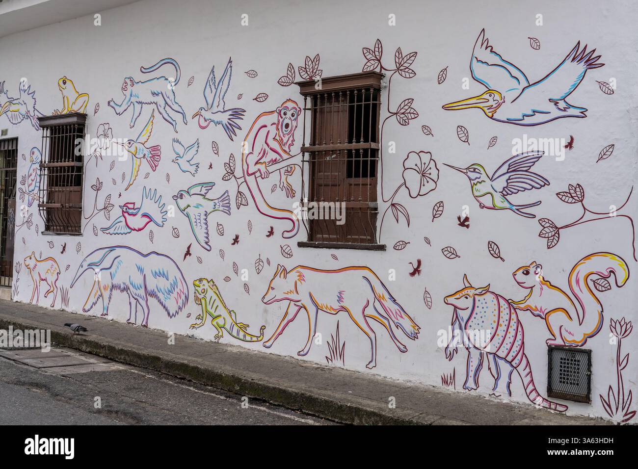 Wall mural of birds and animals on a building with colonial-style ...
