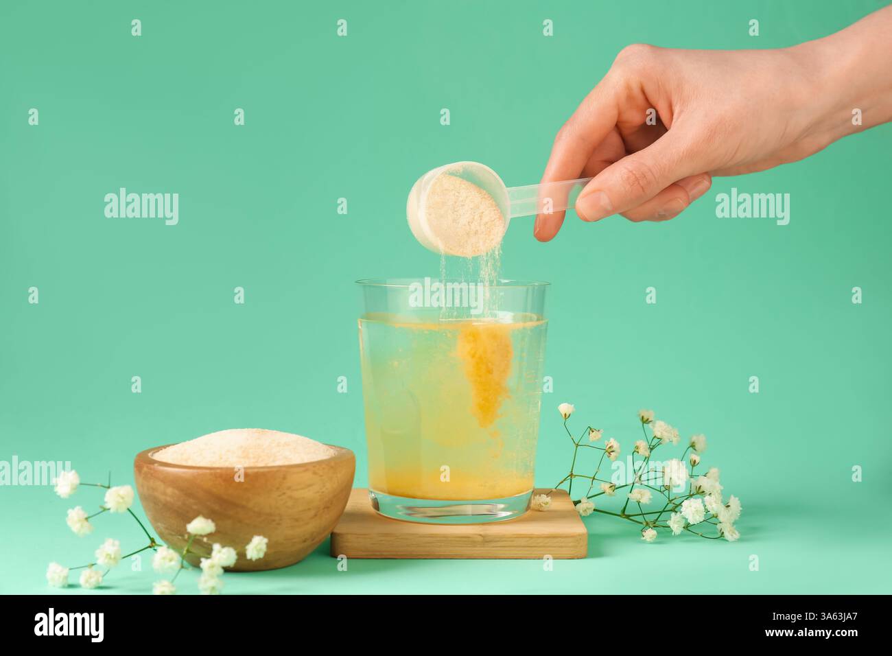 Woman adding collagen powder hi-res stock photography and images - Alamy