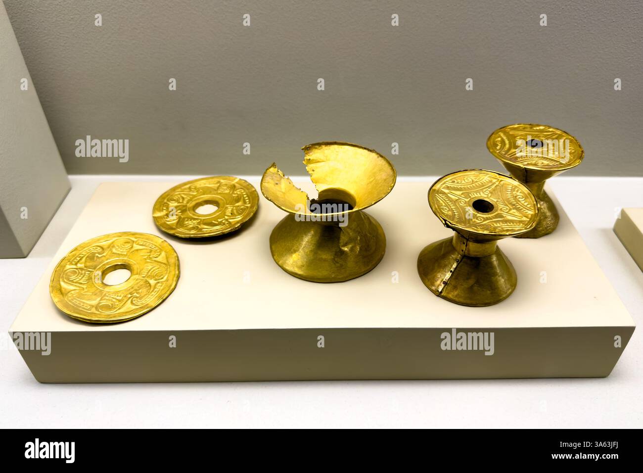 Gold ear gauges or ear plugs from the pre-Hispanic indigenous Calima ...