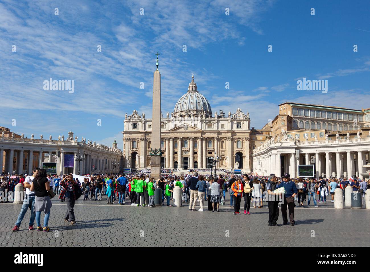 Tourists waiting on Saint Peter's Square around the Vatican obelisk ...