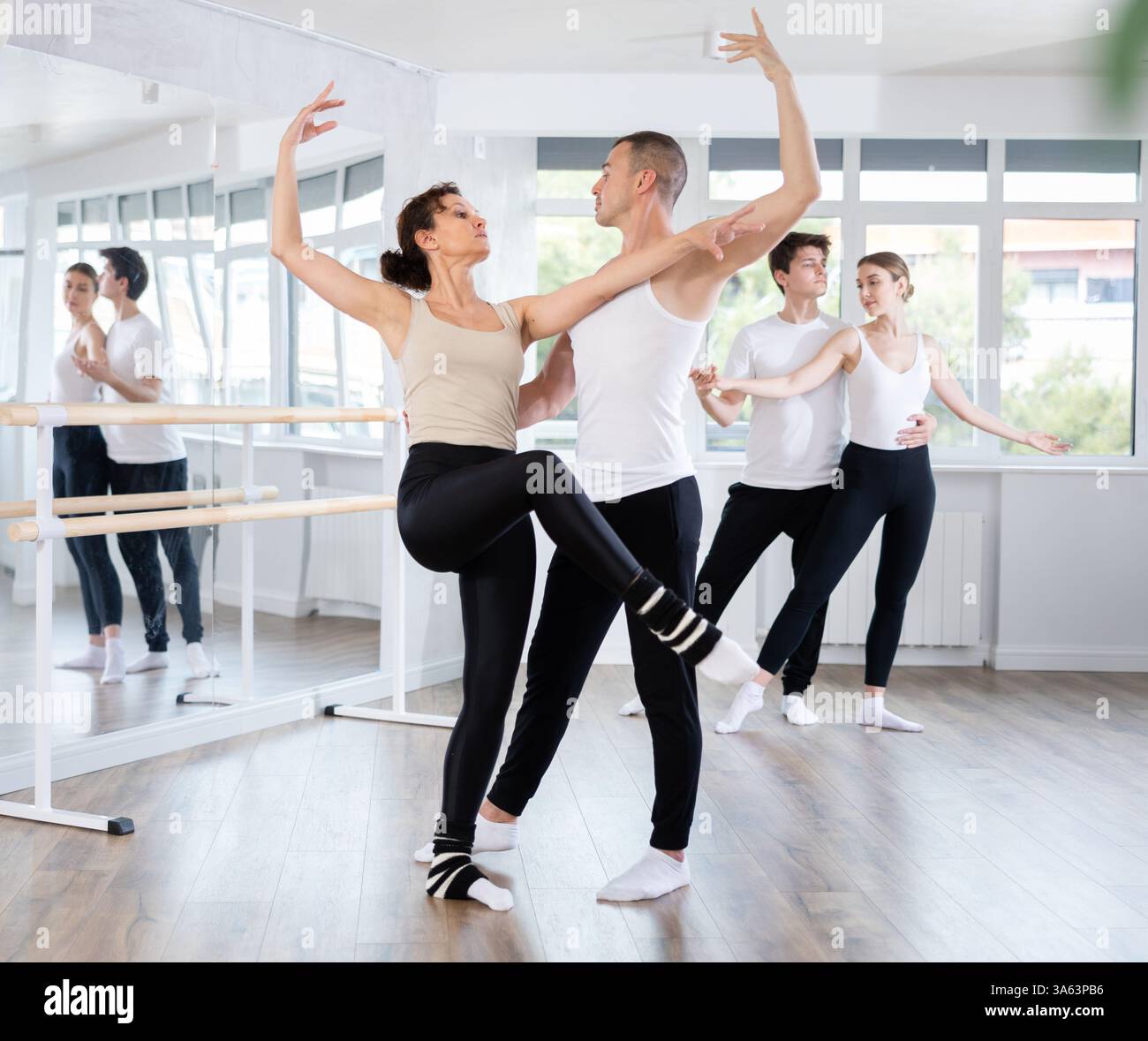 Happy contemporary ballet dancers couple dressed in black and white ...