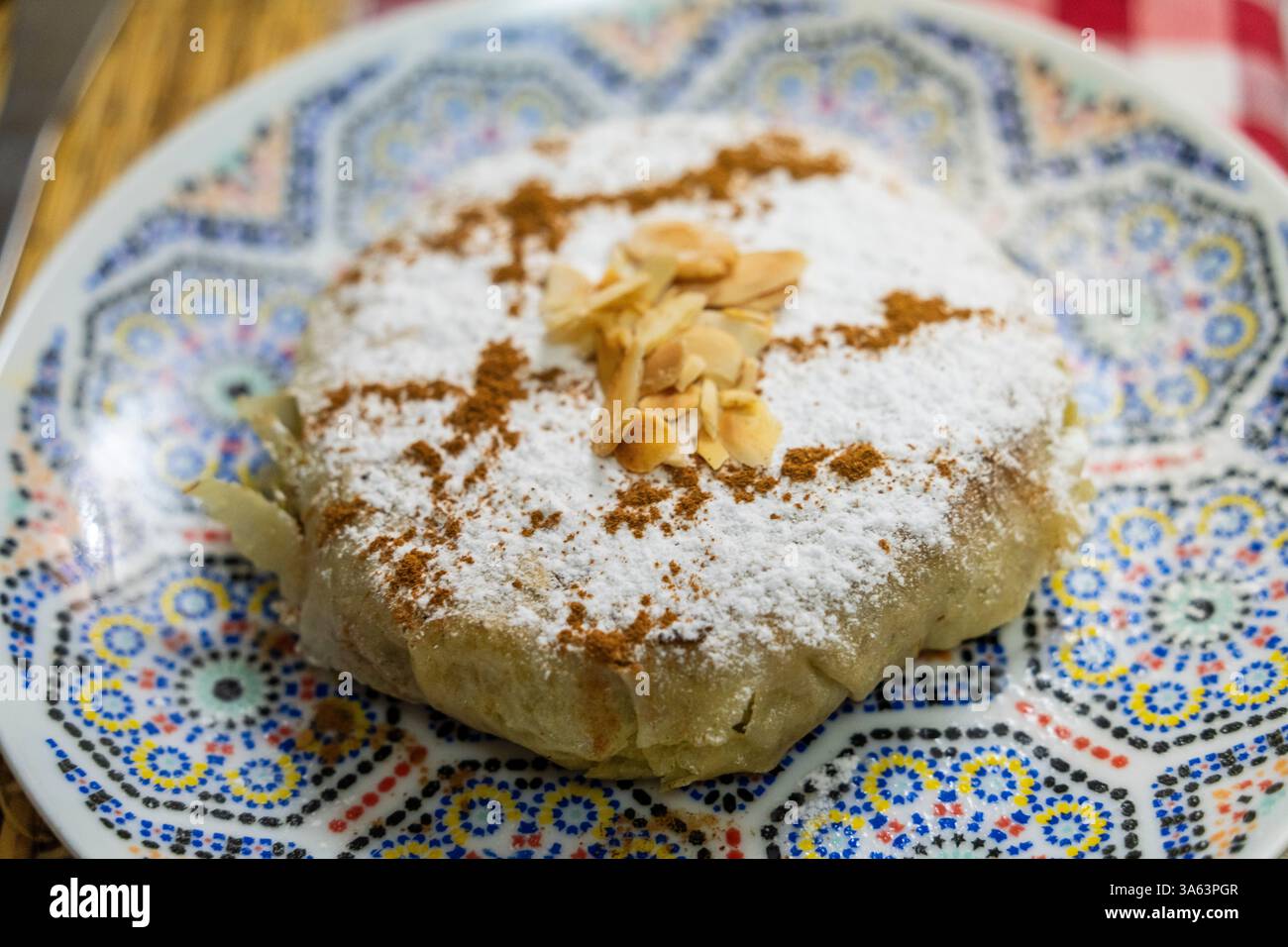 Moroccan pastilla, puff pastry filled with onion, chicken, parsley, and ...