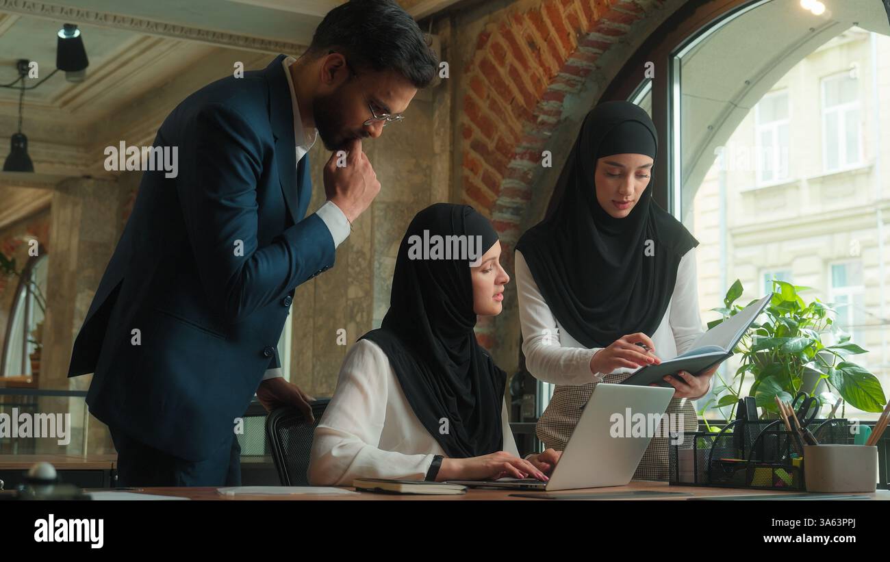 Three coworkers colleagues businessman businesswomen collaborate work ...