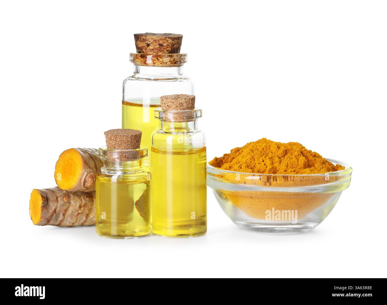 Bottles of turmeric essential oil, powder and raw roots isolated on ...