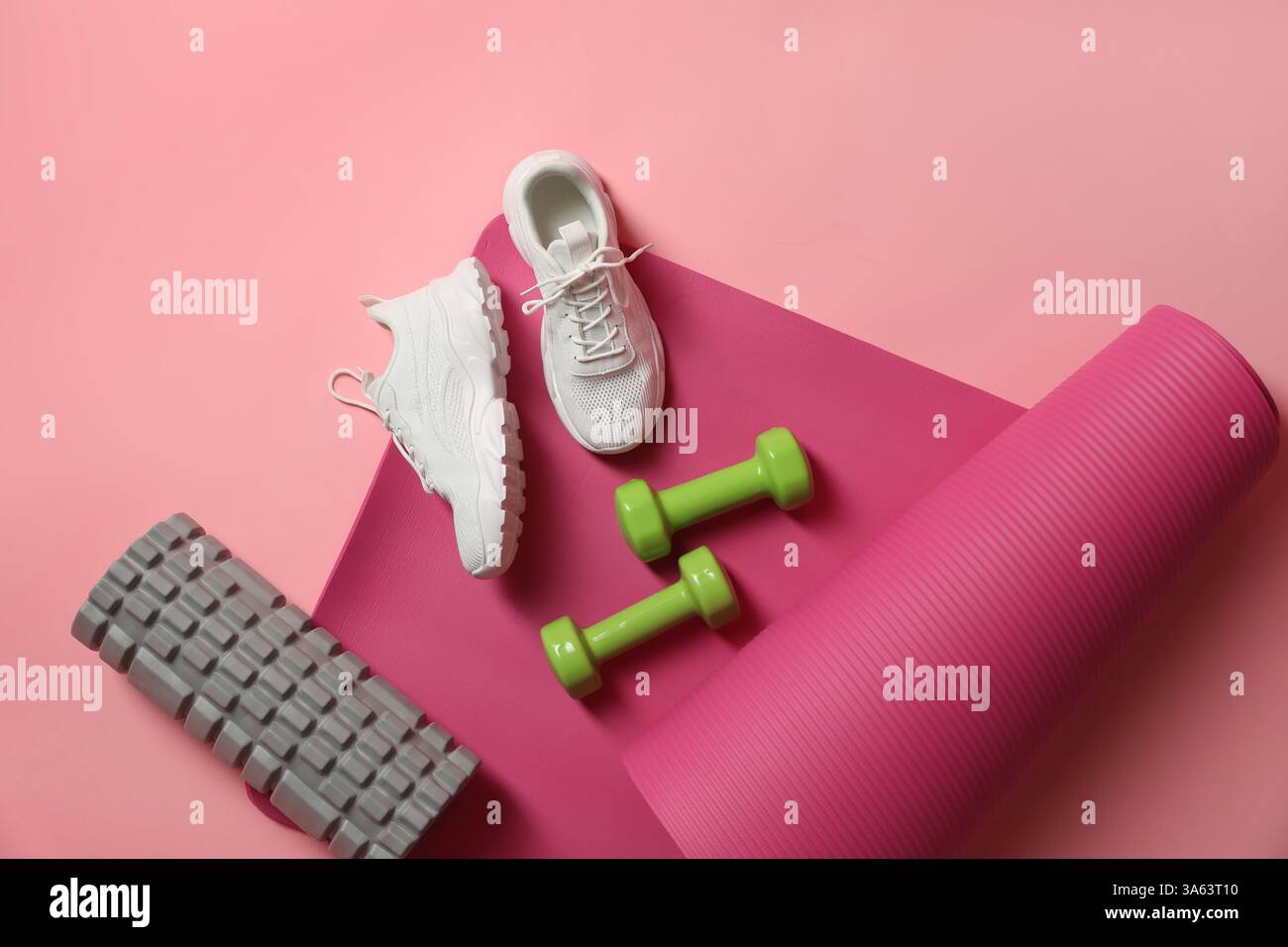 Different gym stuff on pink background, flat lay Stock Photo - Alamy